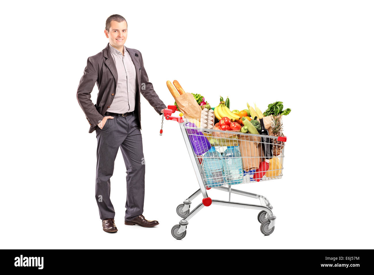 Handsome man with shopping cart full of groceries Stock Photo - Alamy