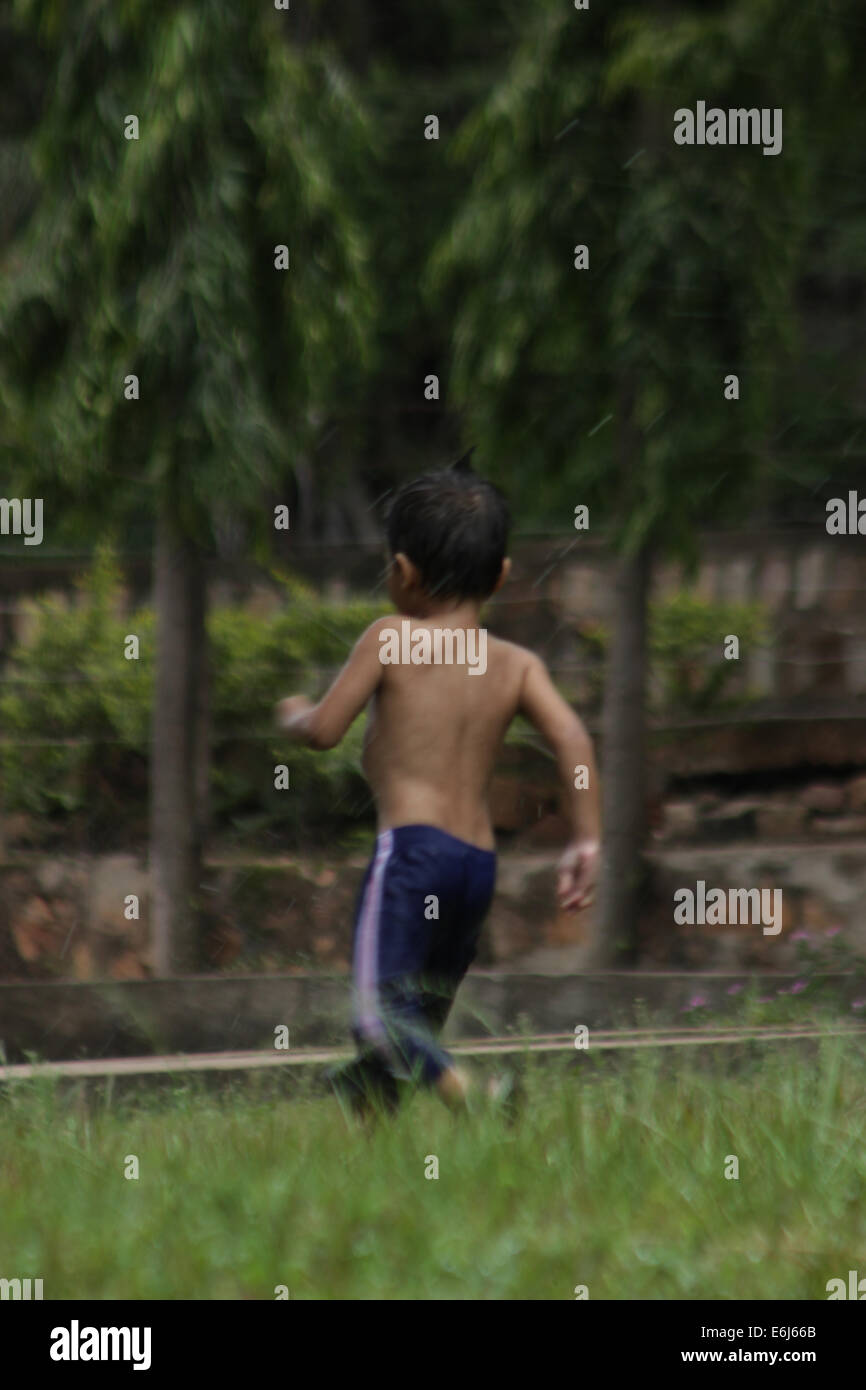A small boy run away from park Stock Photo - Alamy