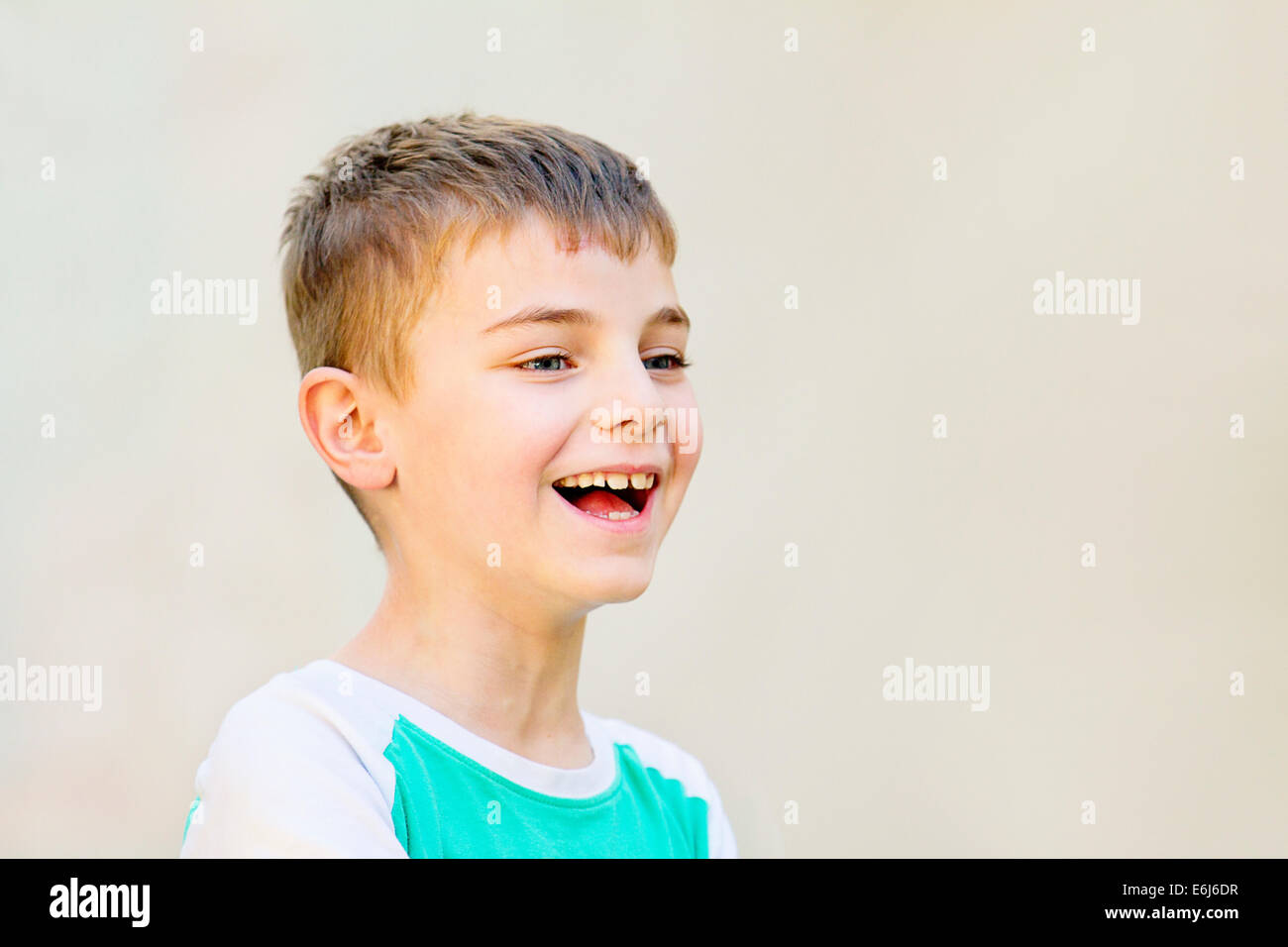 Young boy laughing Stock Photo - Alamy
