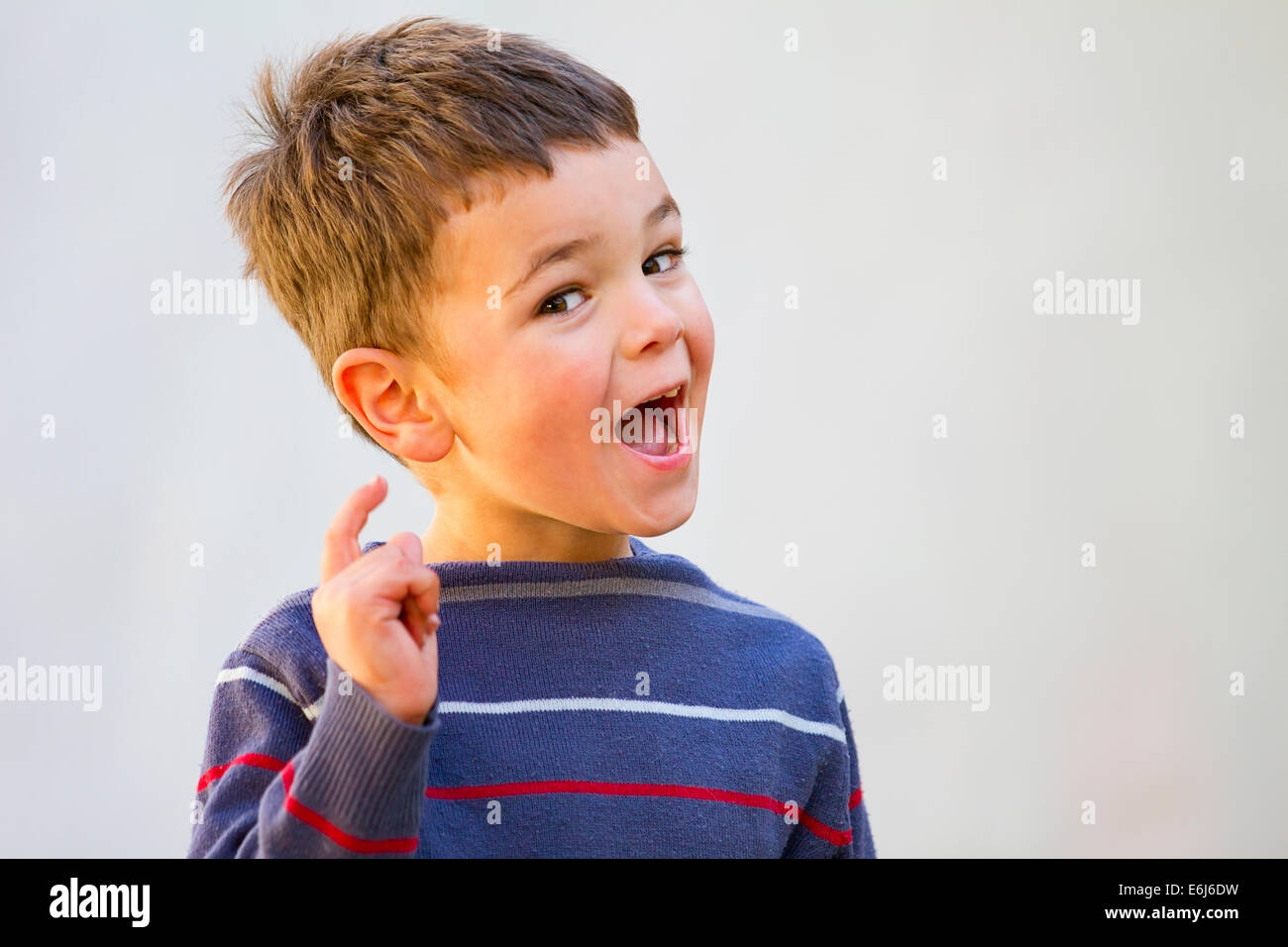 Laughing boy wagging his finger Stock Photo - Alamy