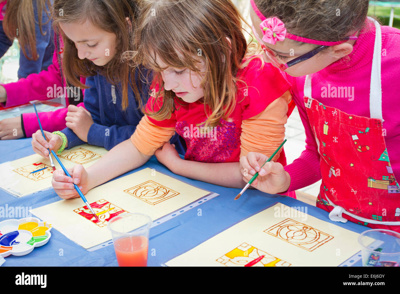 Pretty girls painting together Stock Photo - Alamy