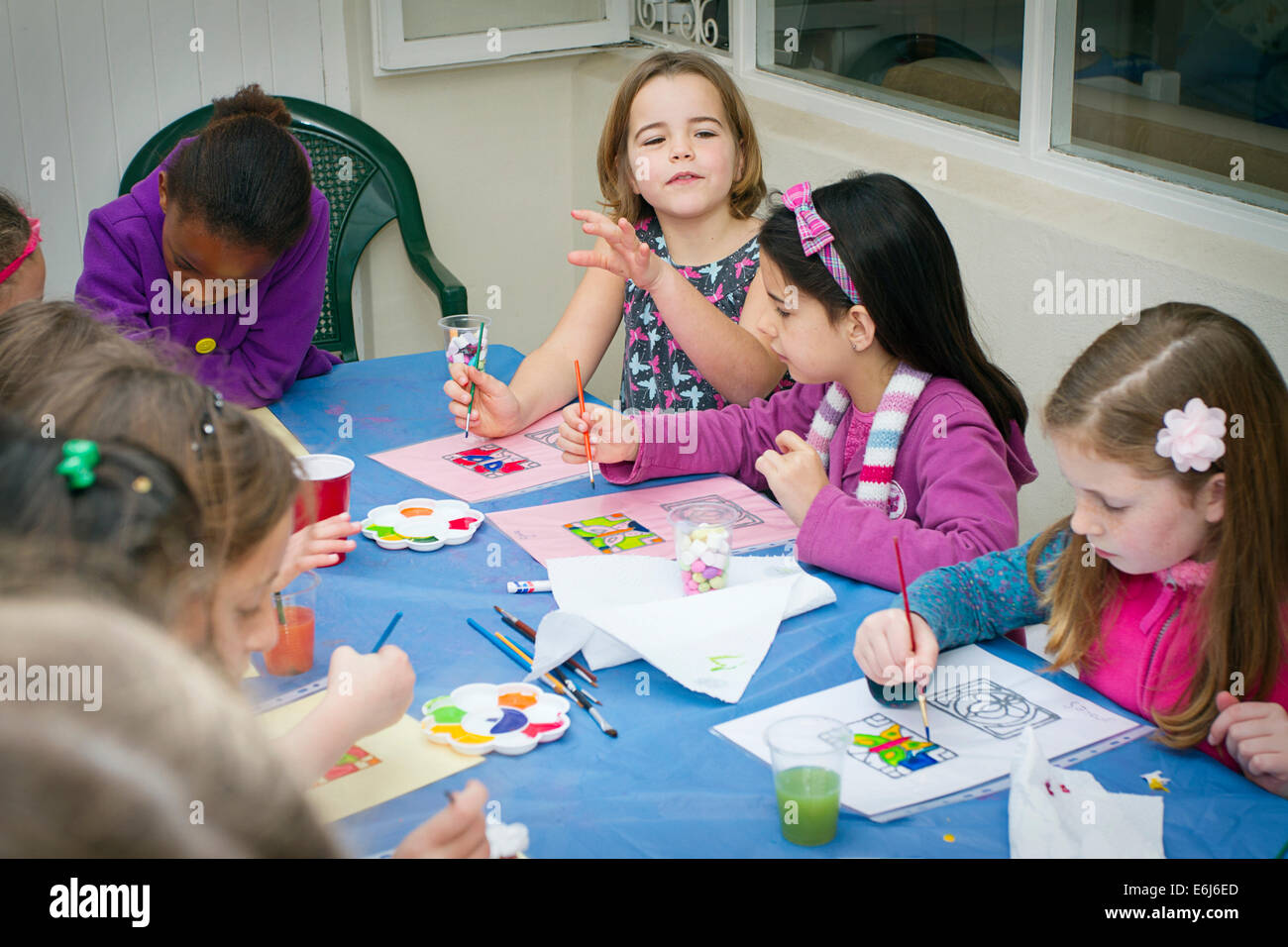 Girls painting together Stock Photo - Alamy