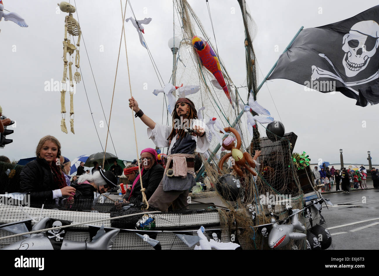 Worthing, Sussex, UK. 25th August, 2014. Pirates in the rain at the ...