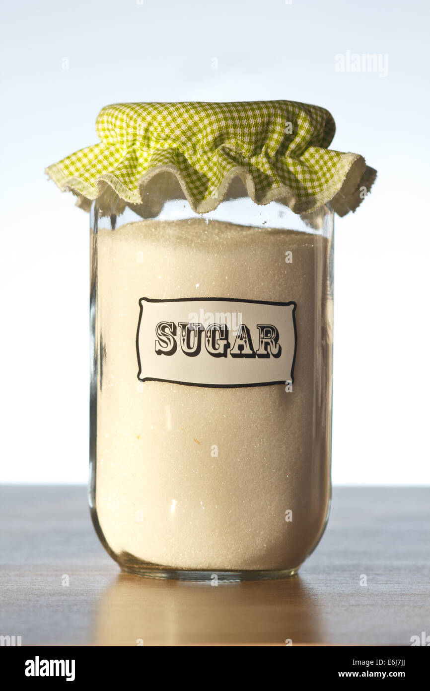 A jar of sugar isolated on white background Stock Photo - Alamy