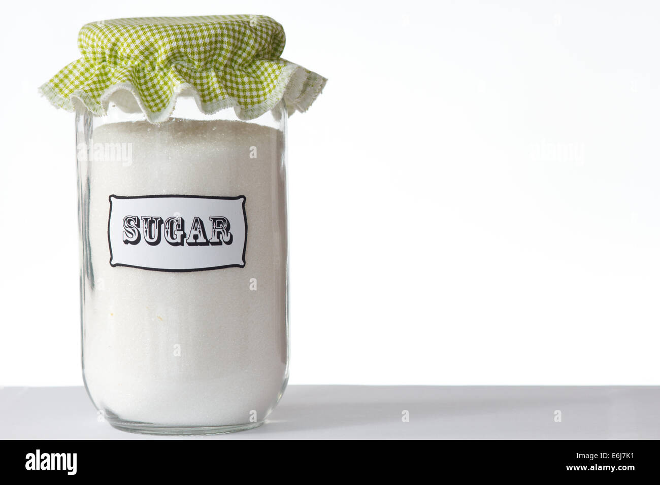 A jar of sugar isolated on white background Stock Photo - Alamy