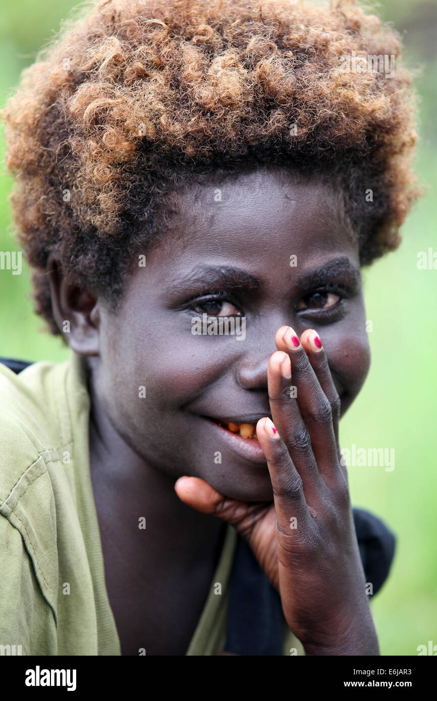 Girl with red curly hair and red teeth from chewing Beetle Nut ...