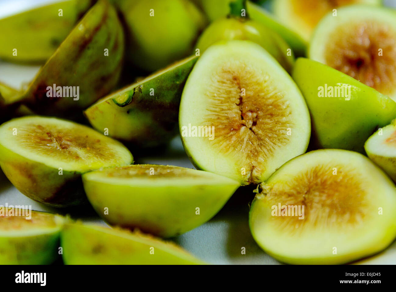 sliced green ripe figs ready to eat Stock Photo - Alamy