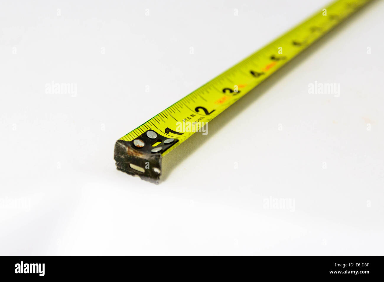 a yellow extended tape measure Stock Photo - Alamy