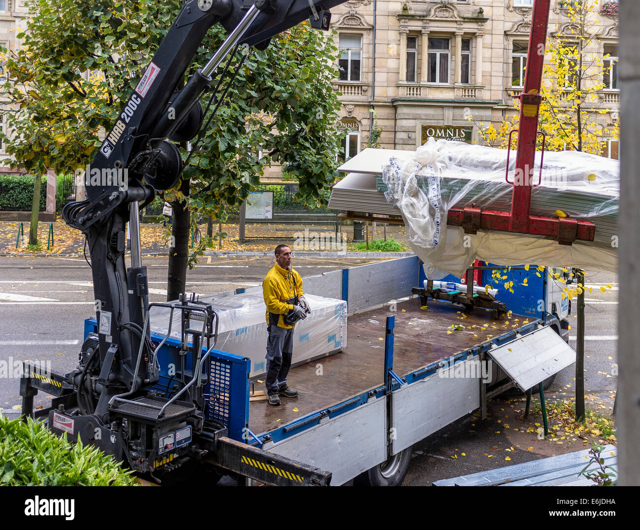 Unload unloading lorry lorries truck trucks hi-res stock photography ...