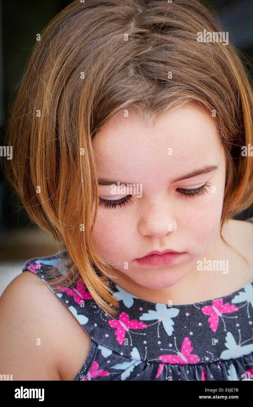 Very pretty young girl looking down Stock Photo - Alamy