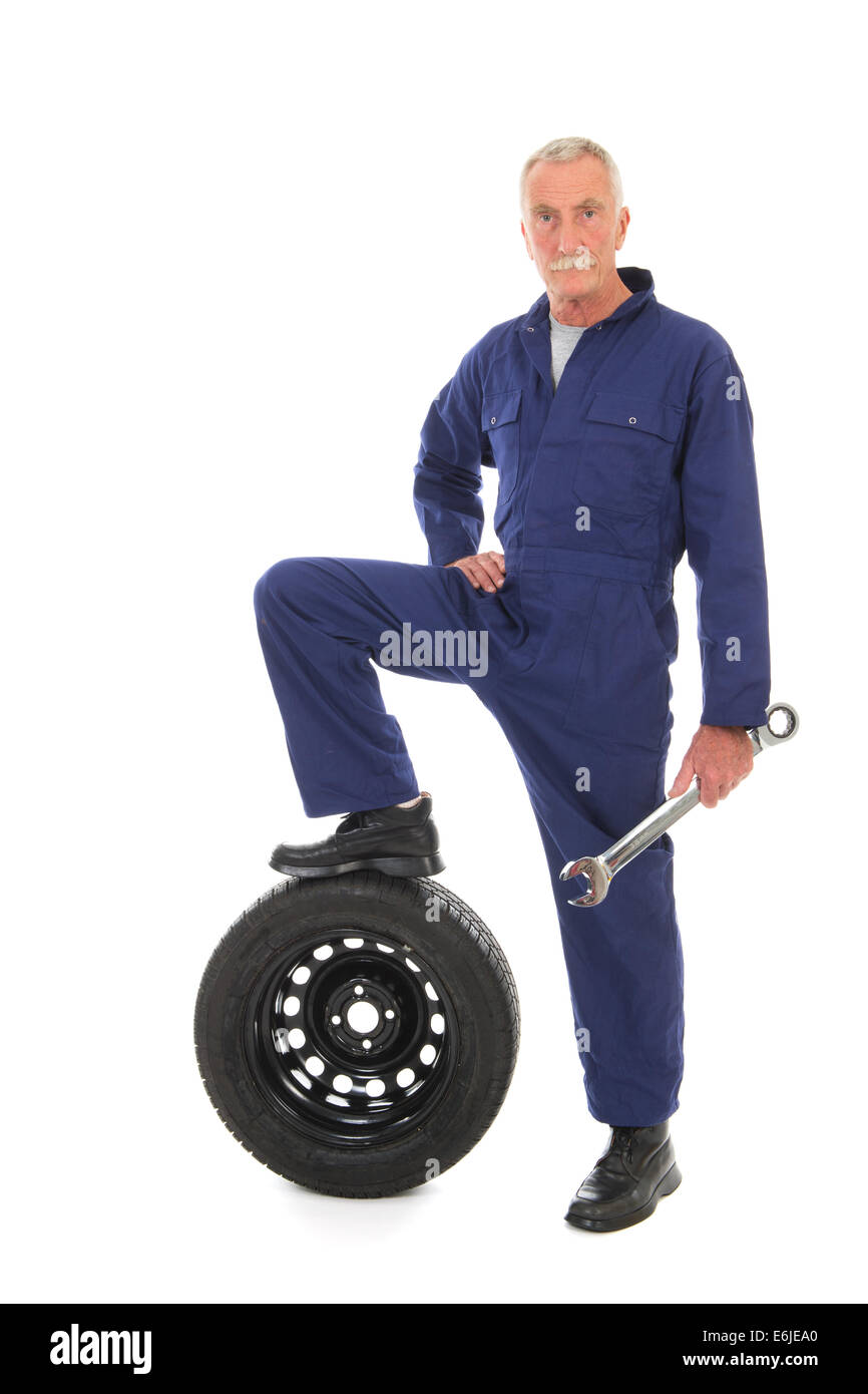 Mechanic repair a wheel with wrench isolated over white background ...