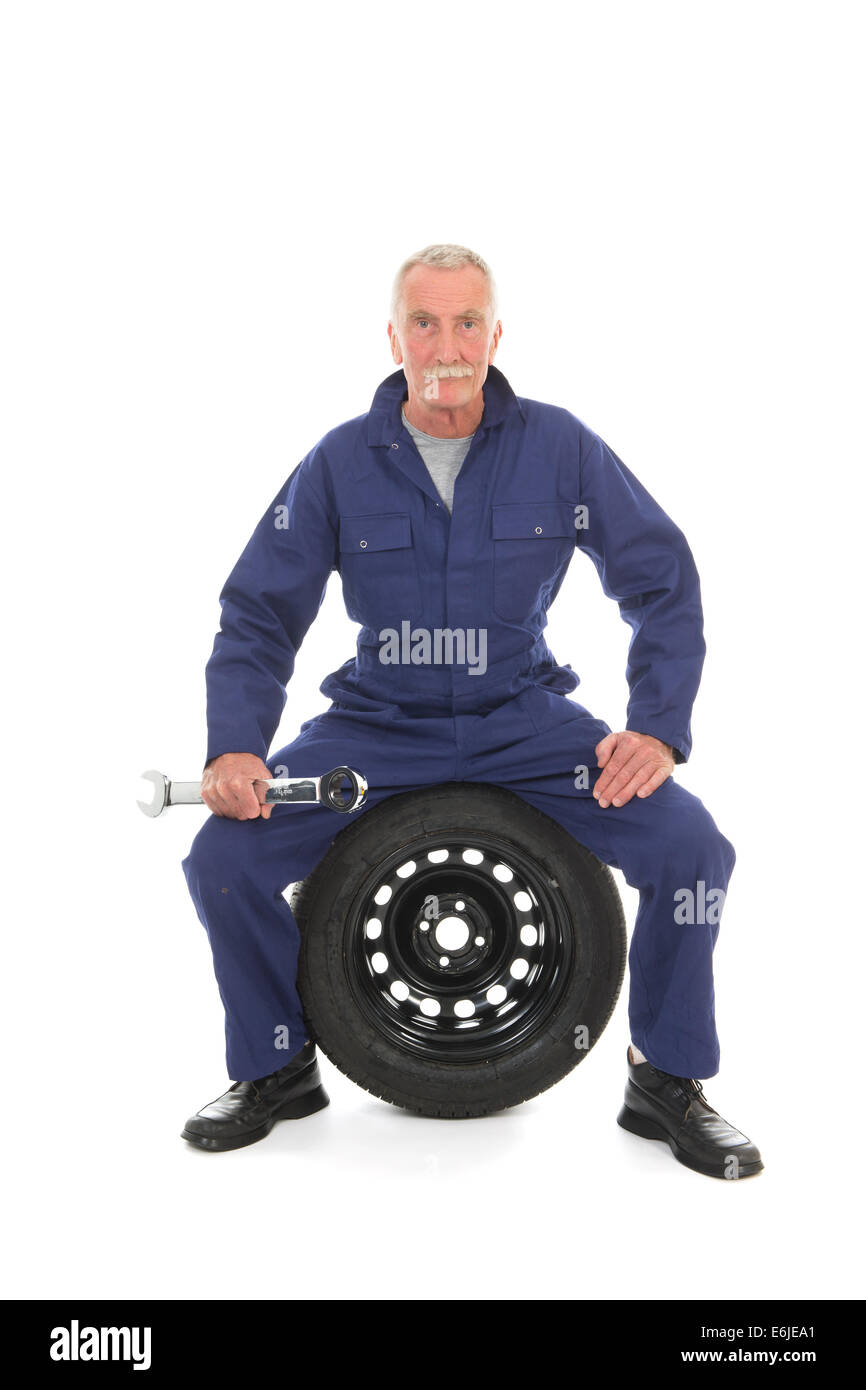 Mechanic repair a wheel with wrench isolated over white background ...
