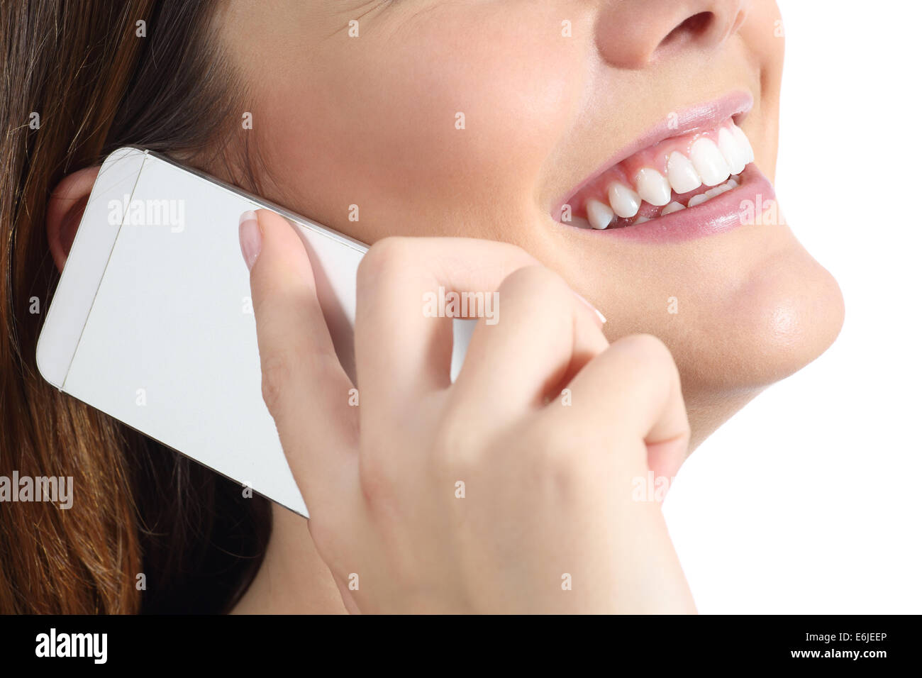 Close up of a woman smiling and calling on the mobile phone isolated on ...