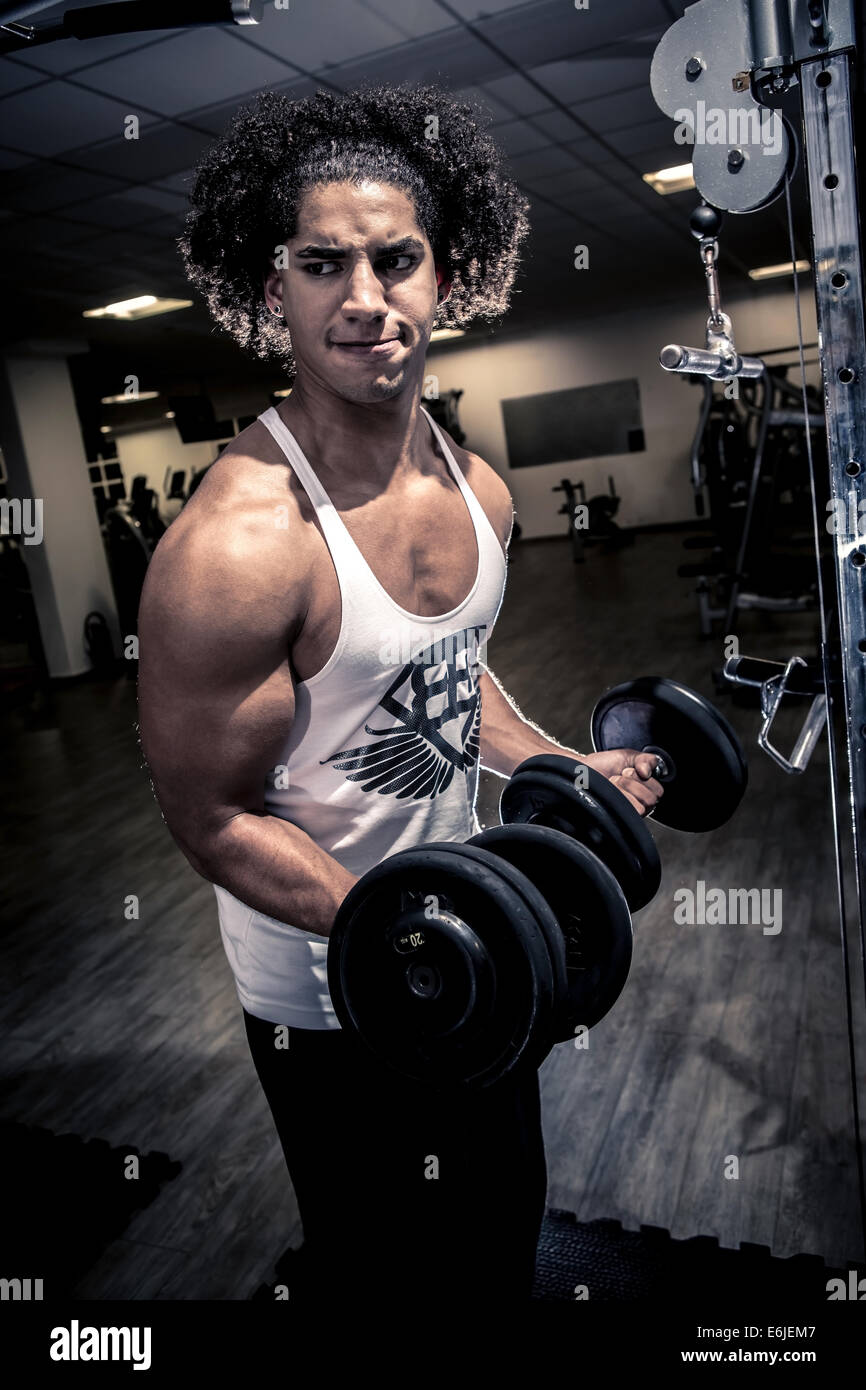 young man at workout in a gym Stock Photo - Alamy