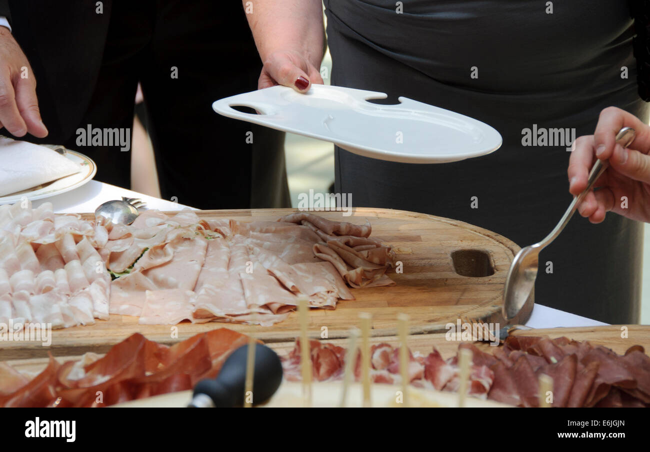 people taking salami Stock Photo - Alamy