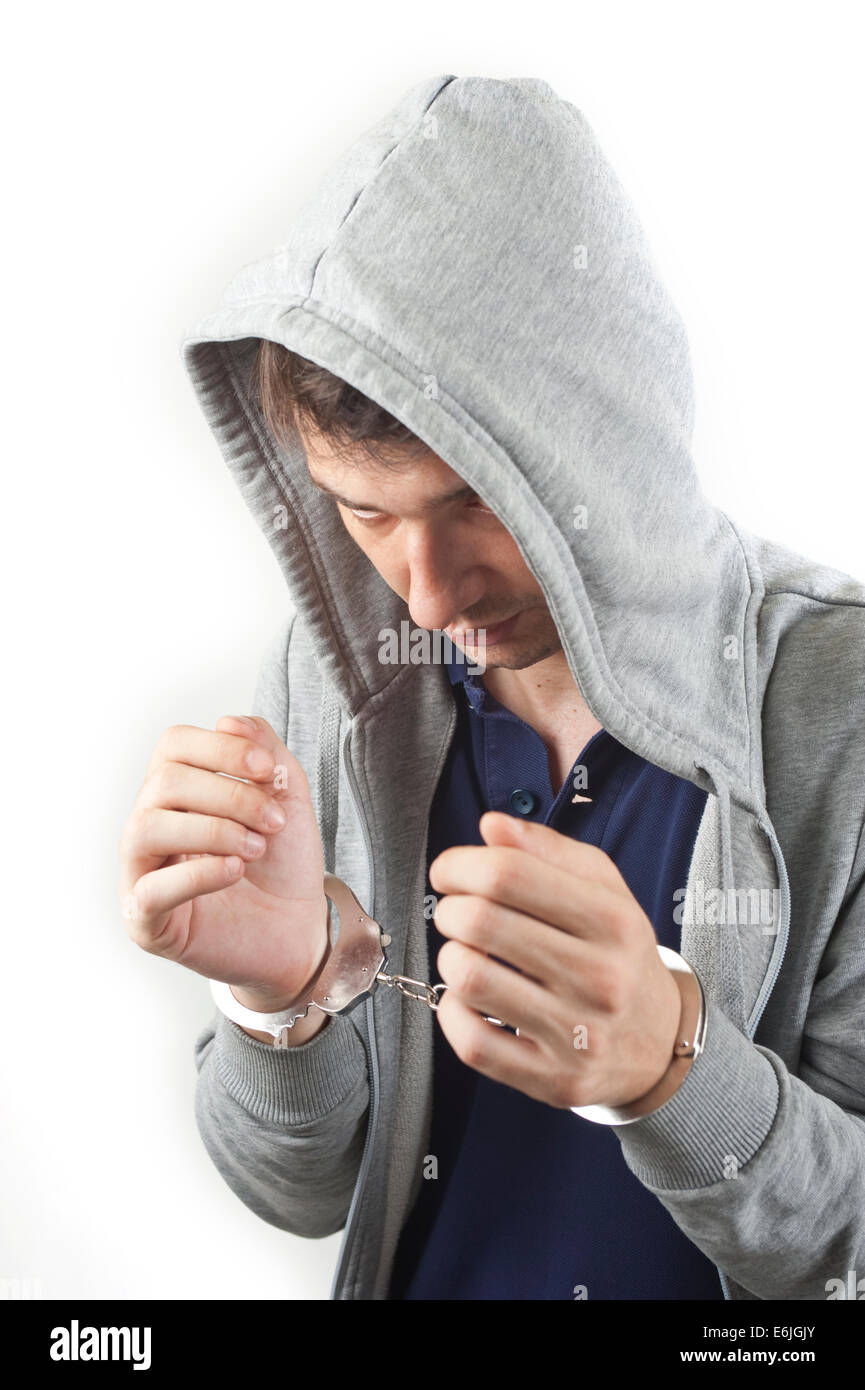 Young man arrested with handcuff isolated on white background Stock ...