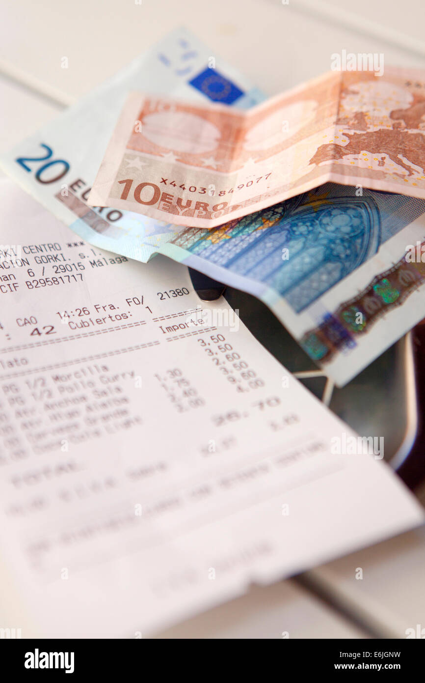 Payment of food bill in Europe with receipt and euros Stock Photo - Alamy