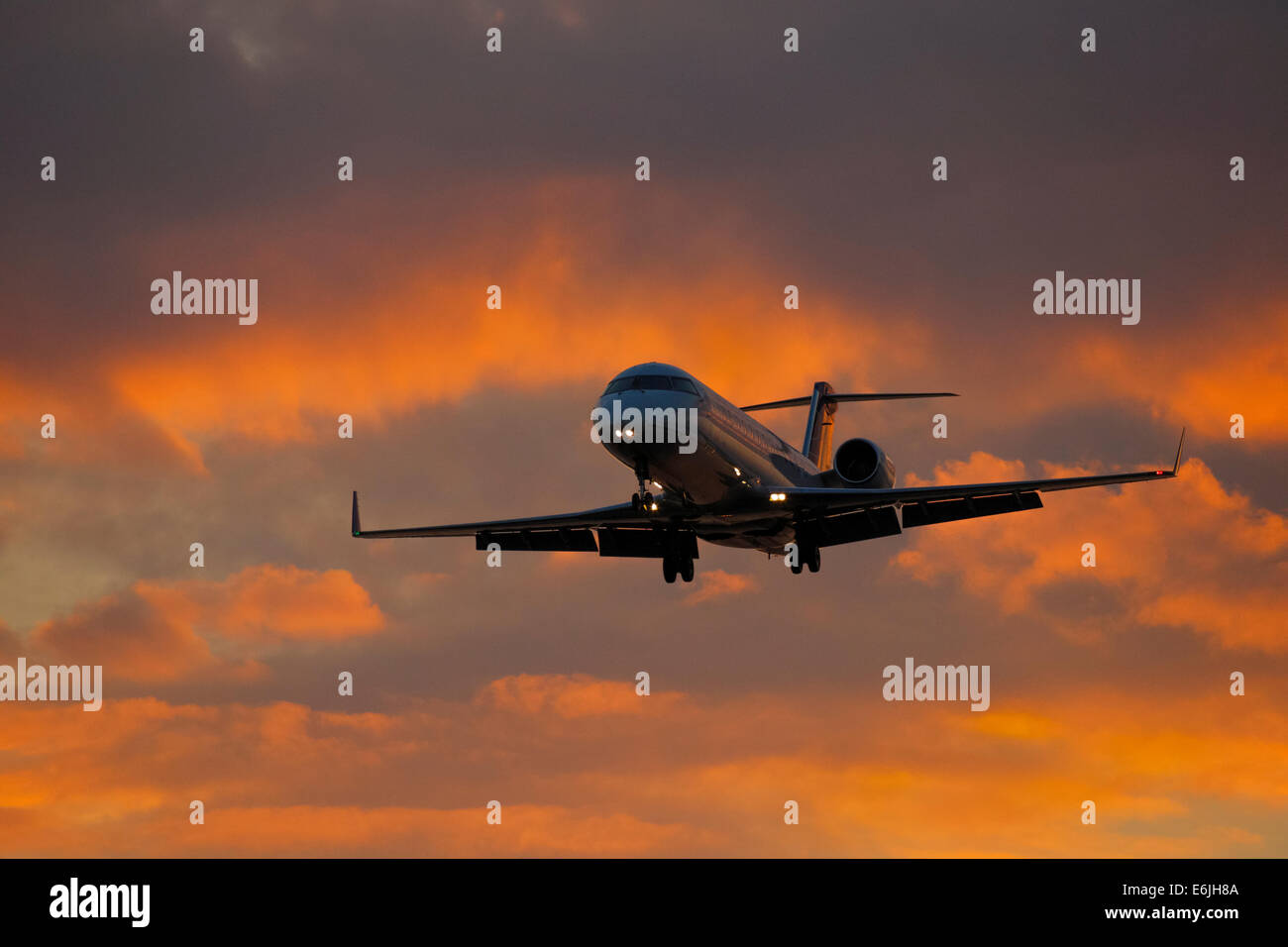 Commercial airliner United Express Bombardier jet on final approach for ...