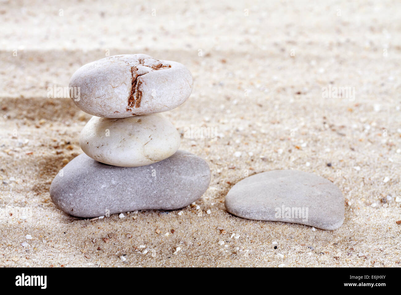 Stack of stones on sand beach Stock Photo - Alamy