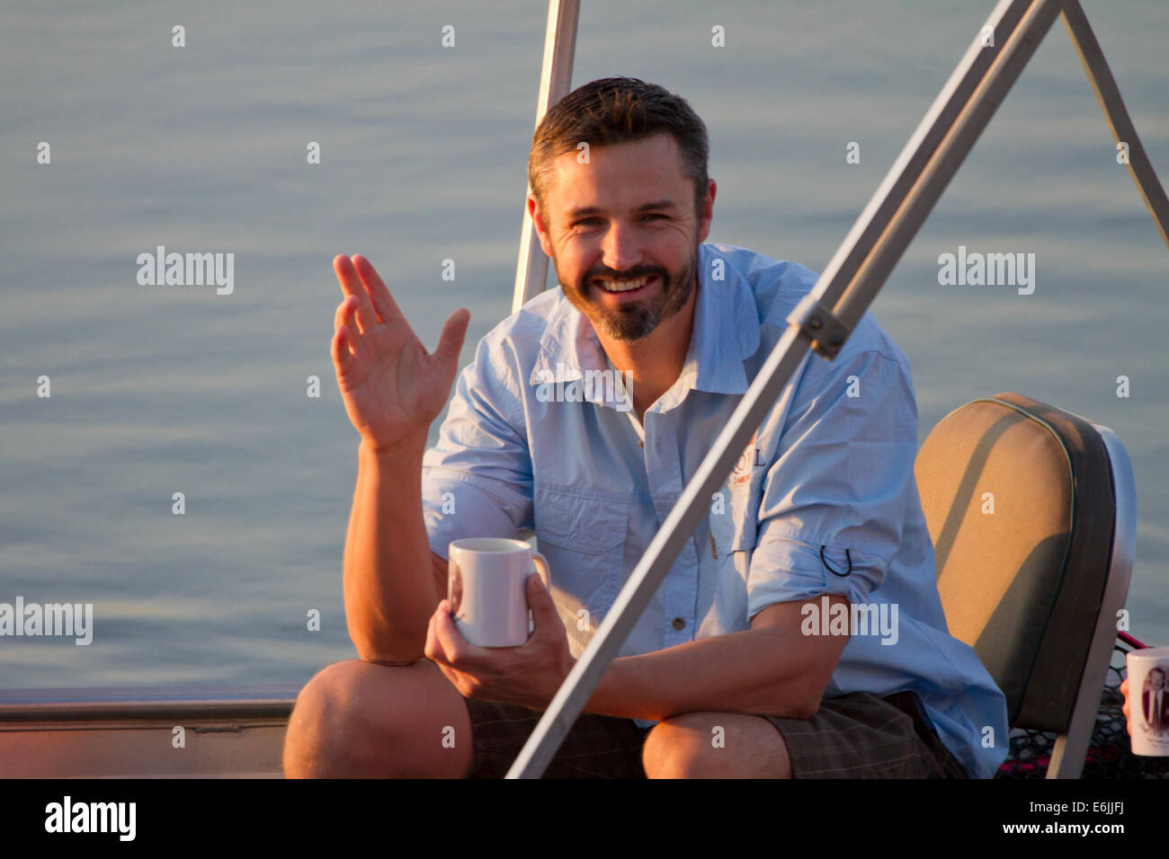Man waving from a boat hi-res stock photography and images - Alamy