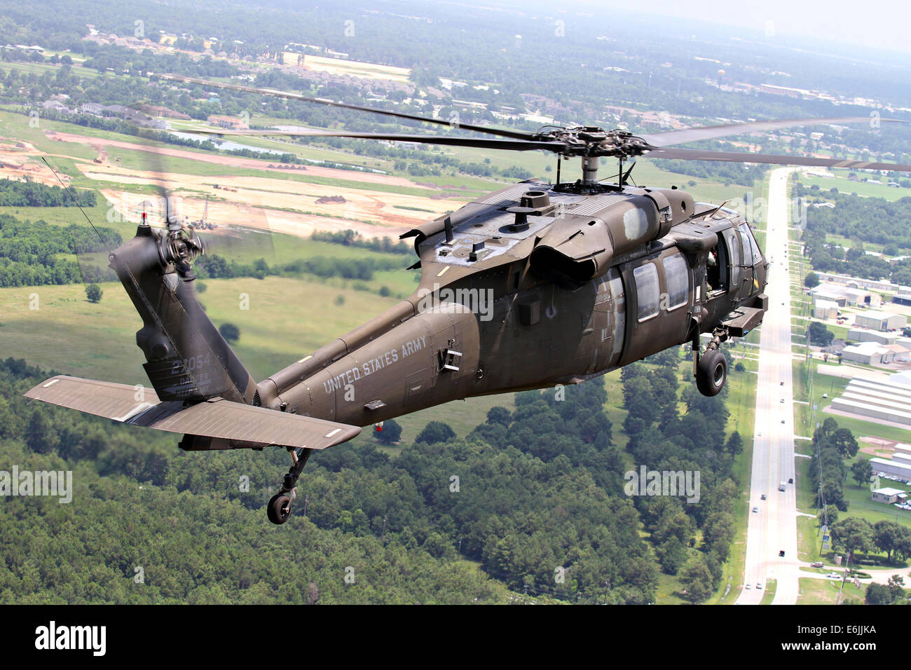 A US Army UH-60 Black Hawk helicopter travels over the Texas ...