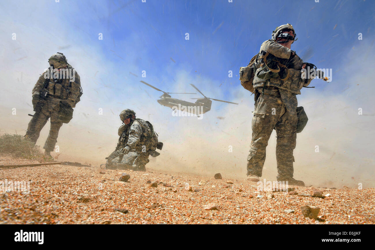 US Army soldiers provide security for a CH-47 Chinook helicopter during ...