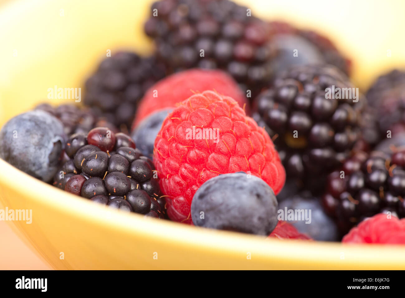 macro picture of fresh berries in yellow bowl Stock Photo - Alamy