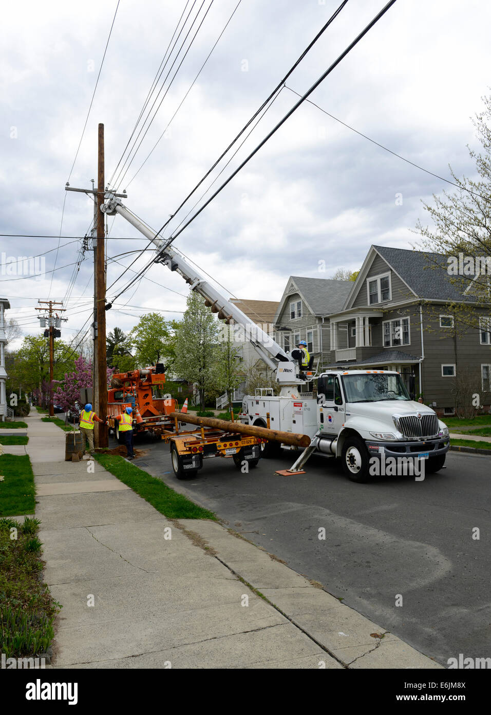 Altec Derrick Digger machine putting up new telephone poles in New ...
