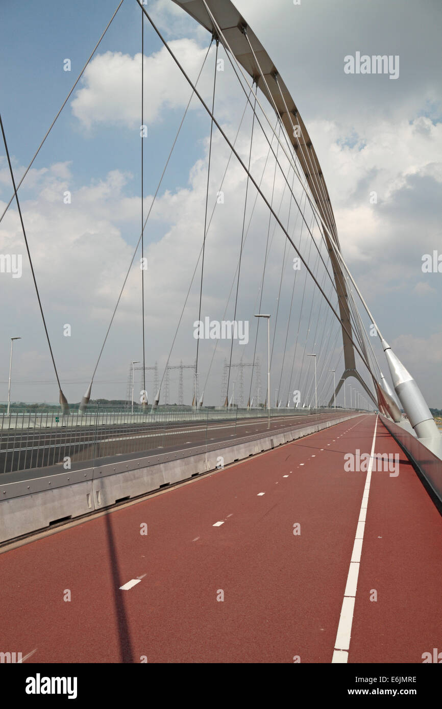 Empty cycle path on the new road bridge, "The Crossing", over the Waal ...