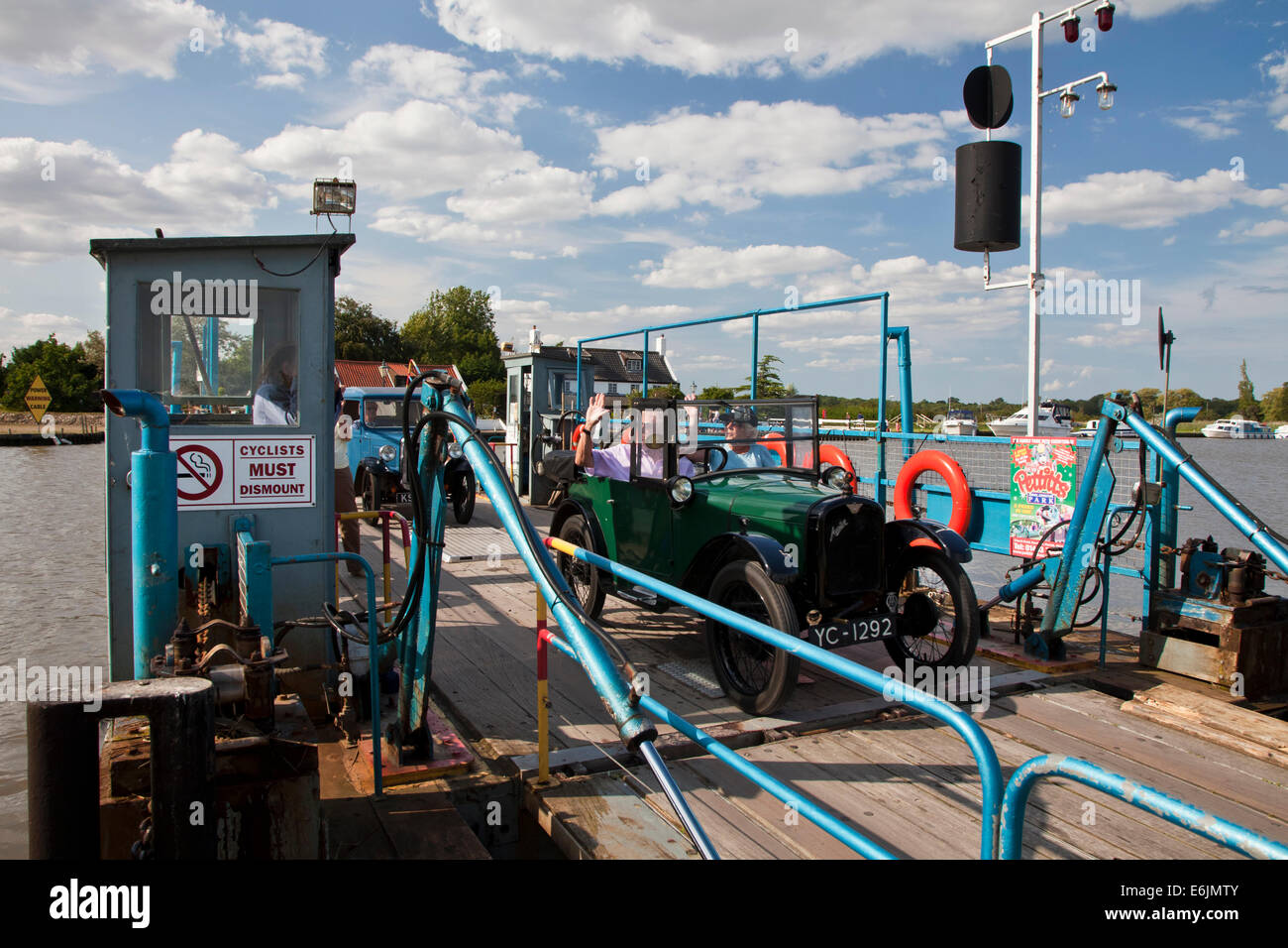 Old Austin drives off the Reedham Ferry on the River Yare in Norfolk ...