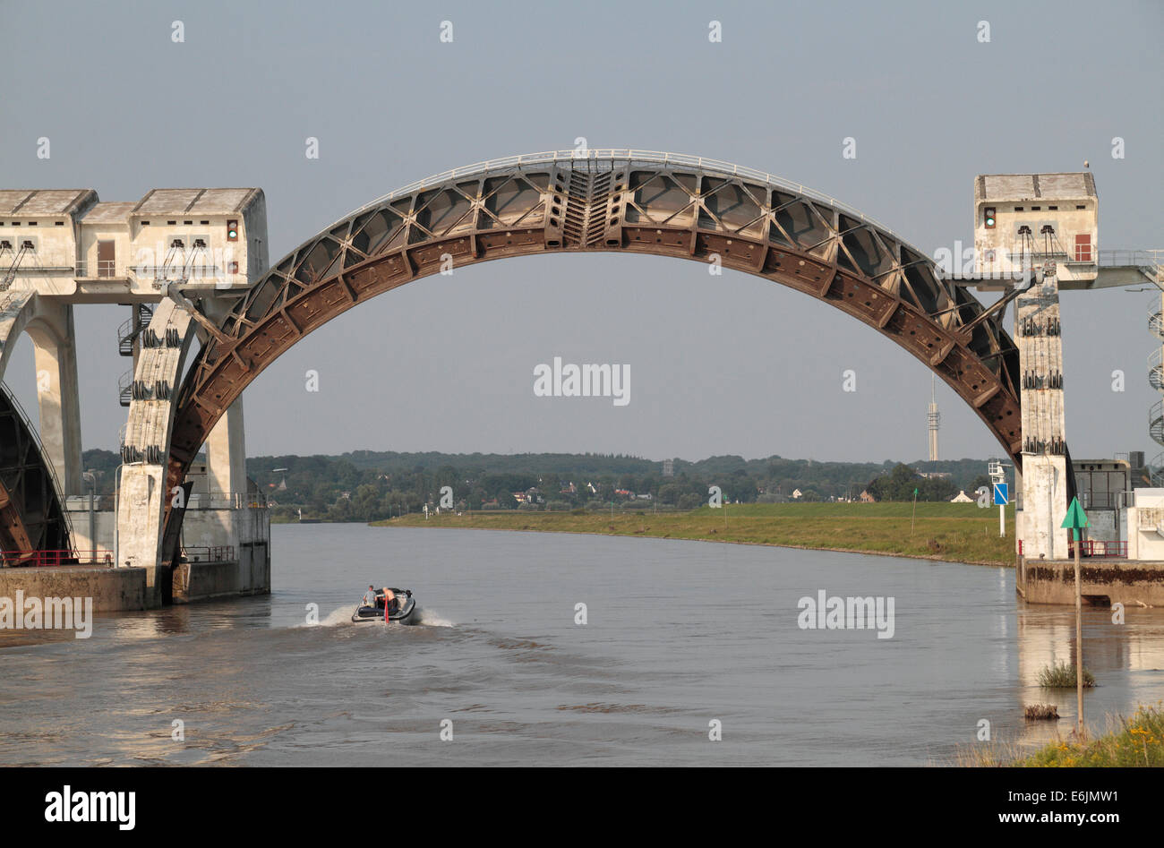 A boat passing under the Driel Wier, a pair of sluice gates (in the ...