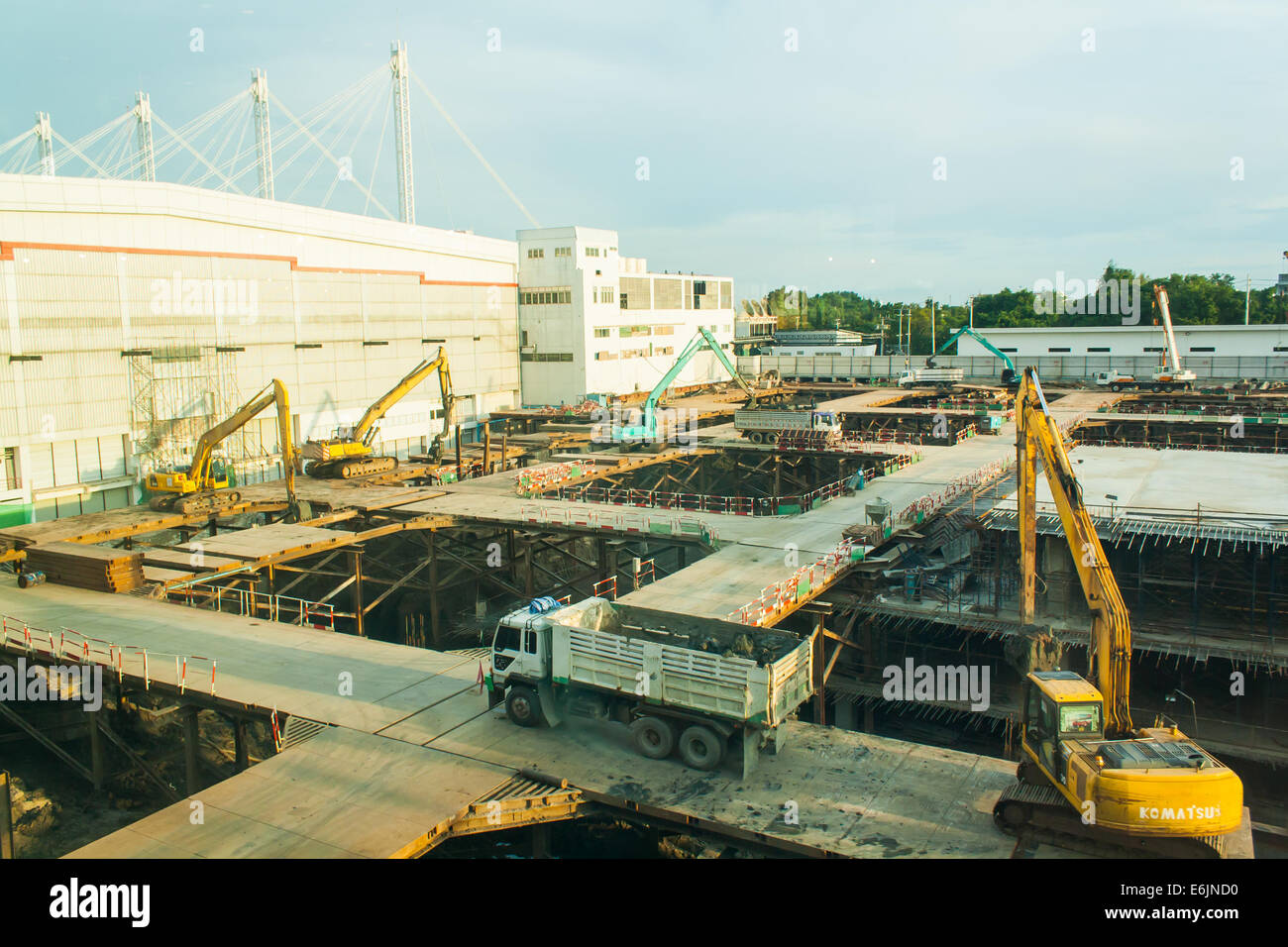 Construction a building in urban by man and machine Stock Photo - Alamy