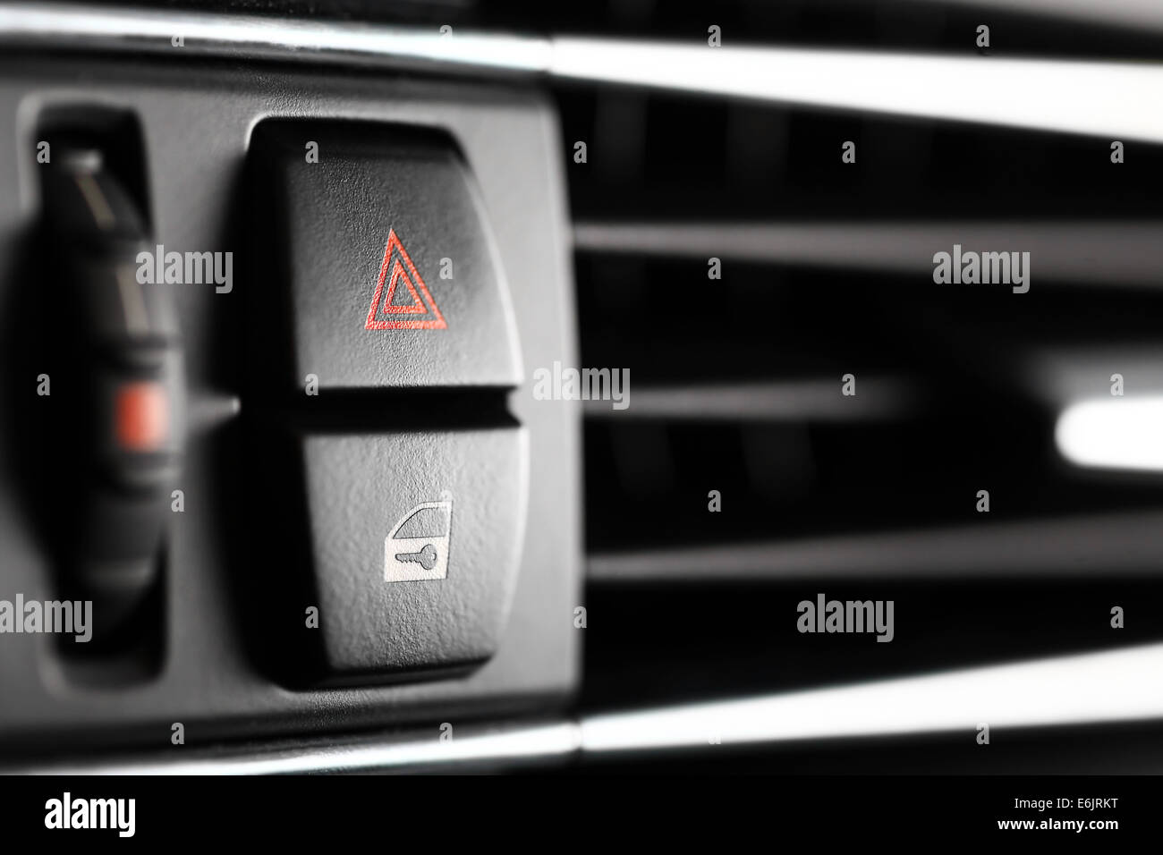 Detail of a warning button in a car Stock Photo - Alamy
