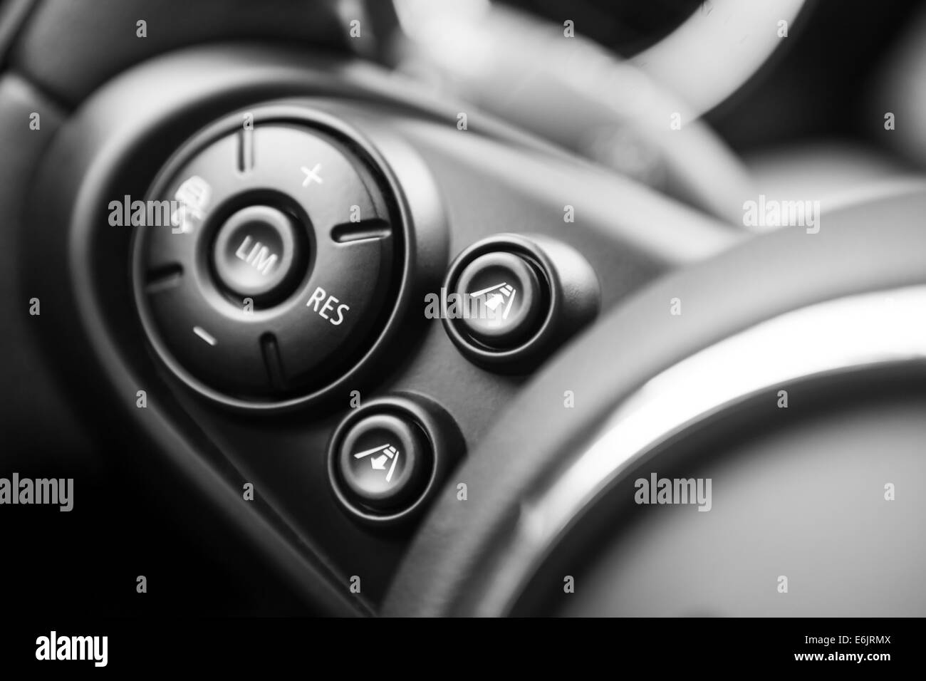 Detail of the cruise control button on a steering wheel Stock Photo - Alamy