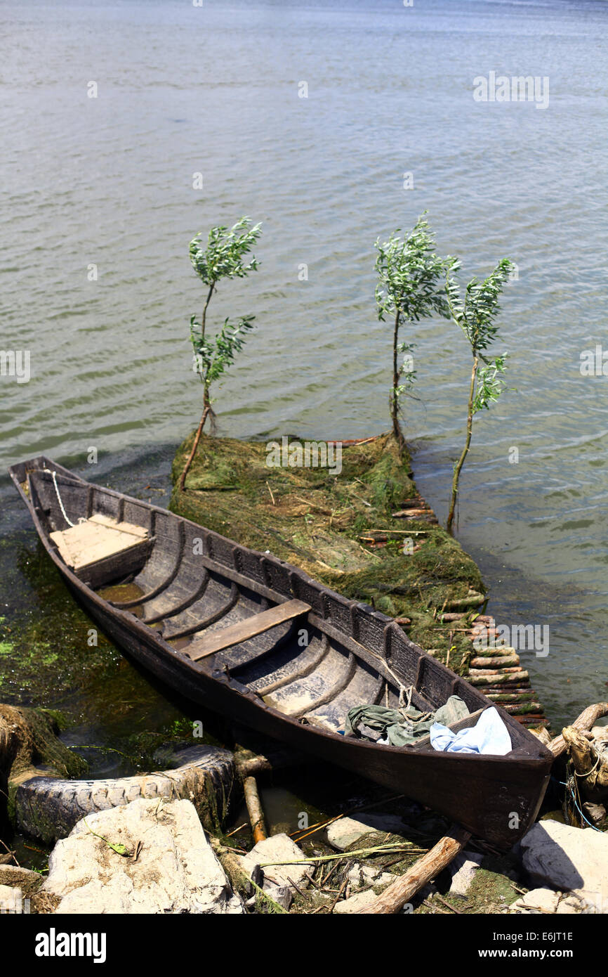 Color picture of a wooden boat on a river bank Stock Photo - Alamy