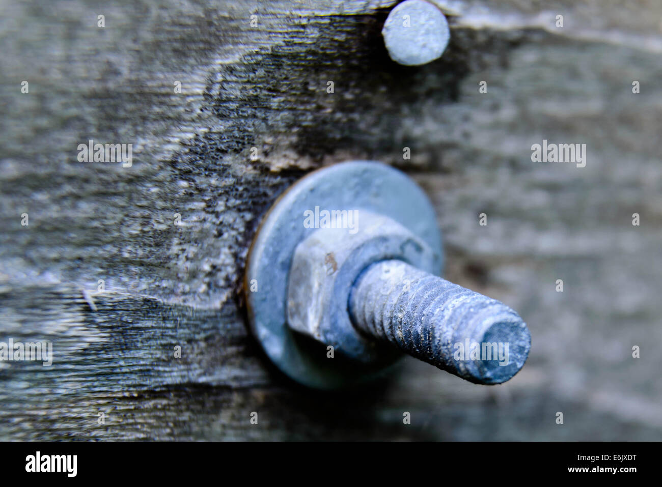 galvanized bolt through outdoor weathered wood Stock Photo - Alamy