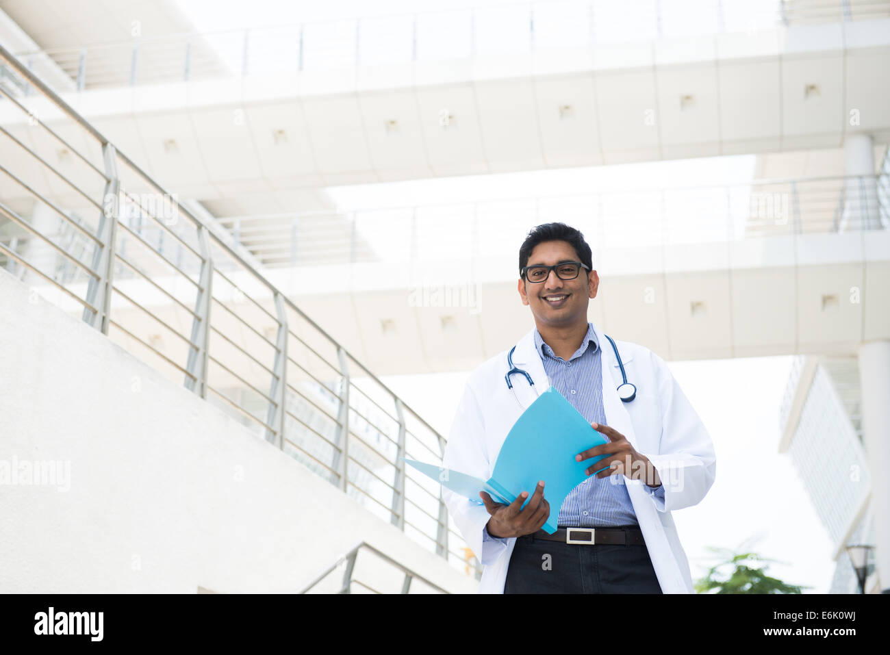 Doctor reading report hi-res stock photography and images - Alamy