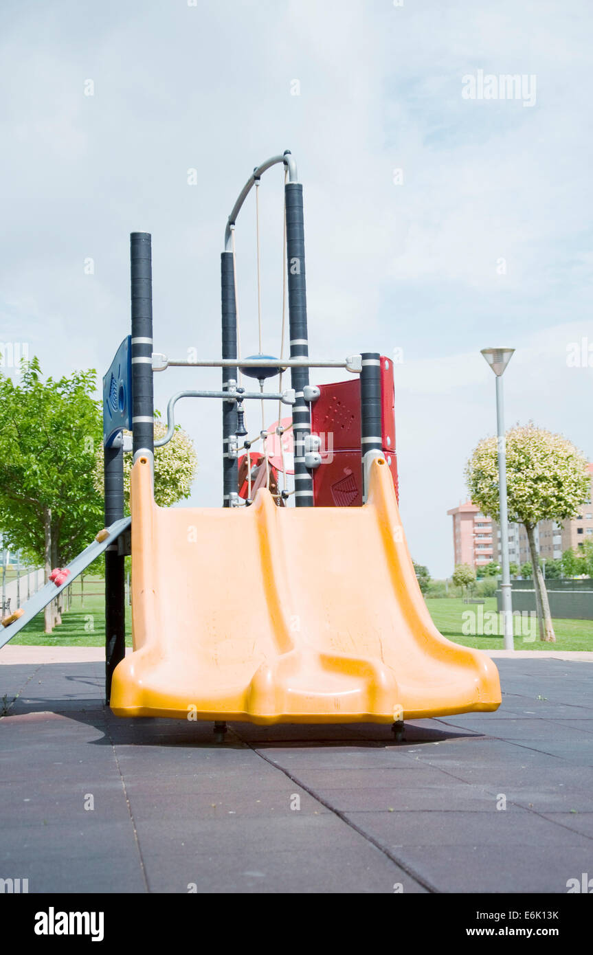 A double toboggan in a park for kids Stock Photo - Alamy