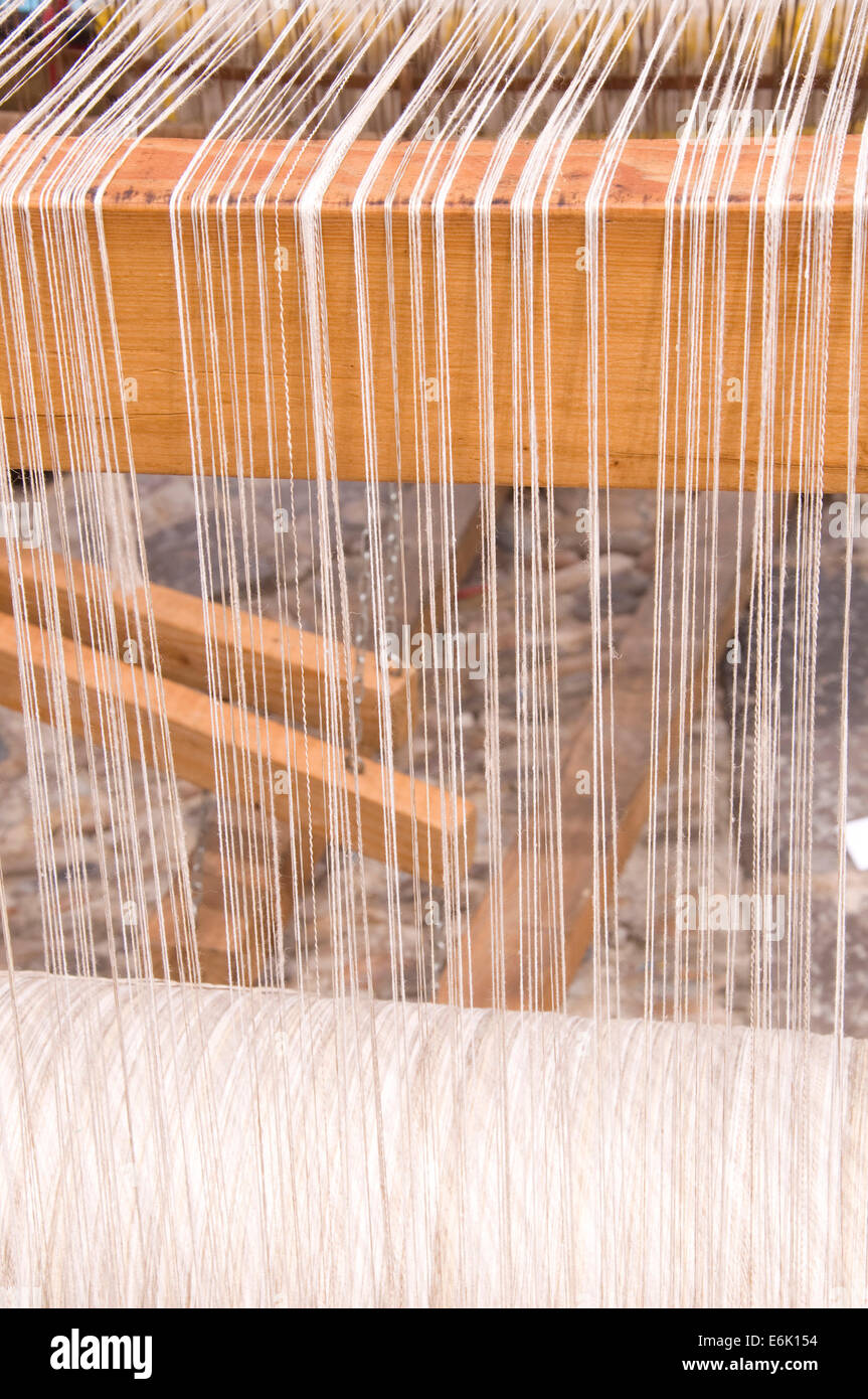 An old loom machine still working with its threads Stock Photo - Alamy