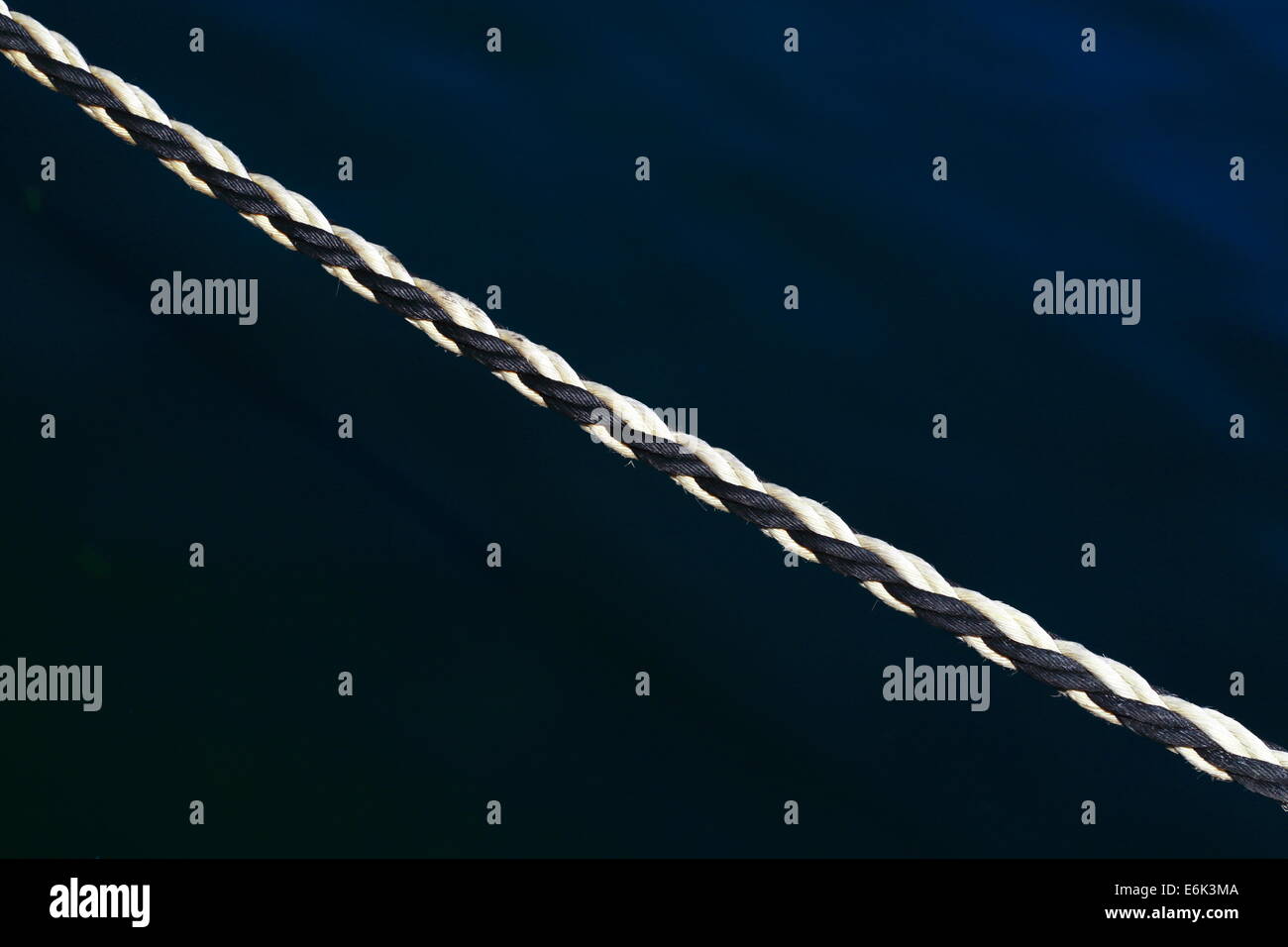 A thick mooring line dangles above the water at Fishing Boat Harbour ...