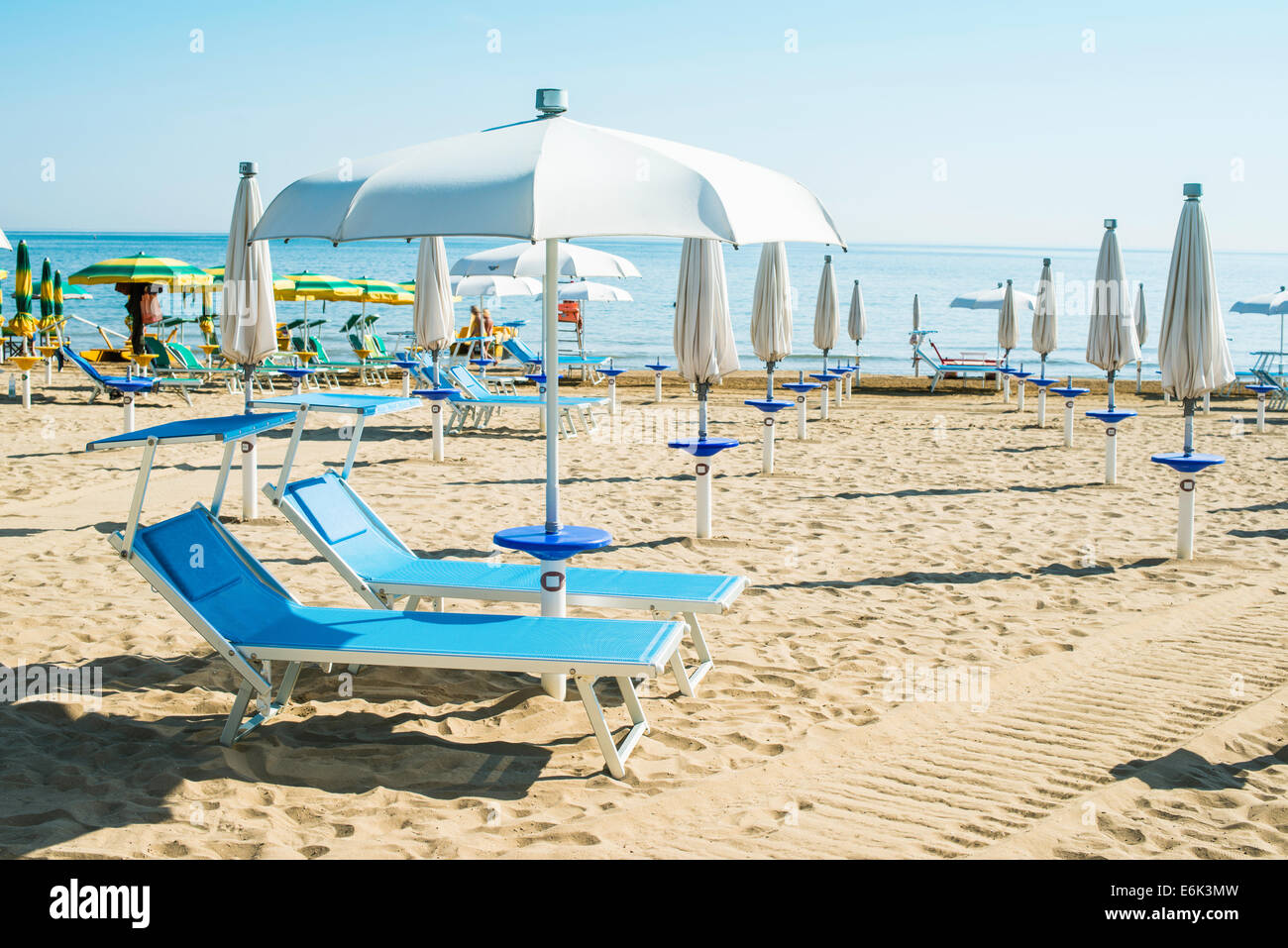 Blue sunbeds and umbrellas on the beach Stock Photo - Alamy