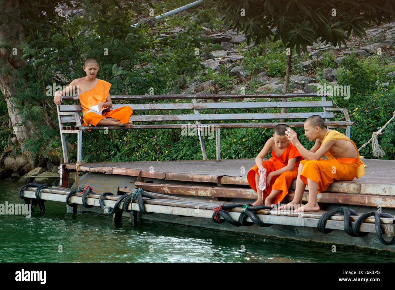 Young monks are resting by the river,religion and pas time Stock Photo ...