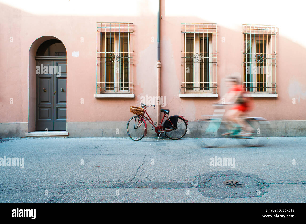 Red old Italian bicycle on sunlight. Ancient buildings Stock Photo - Alamy