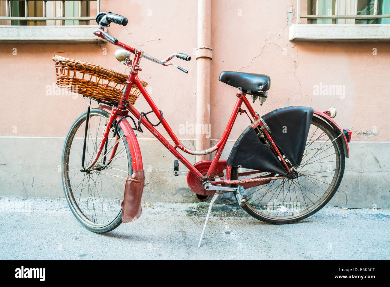 Red old Italian bicycle on sunlight. Ancient buildings Stock Photo - Alamy