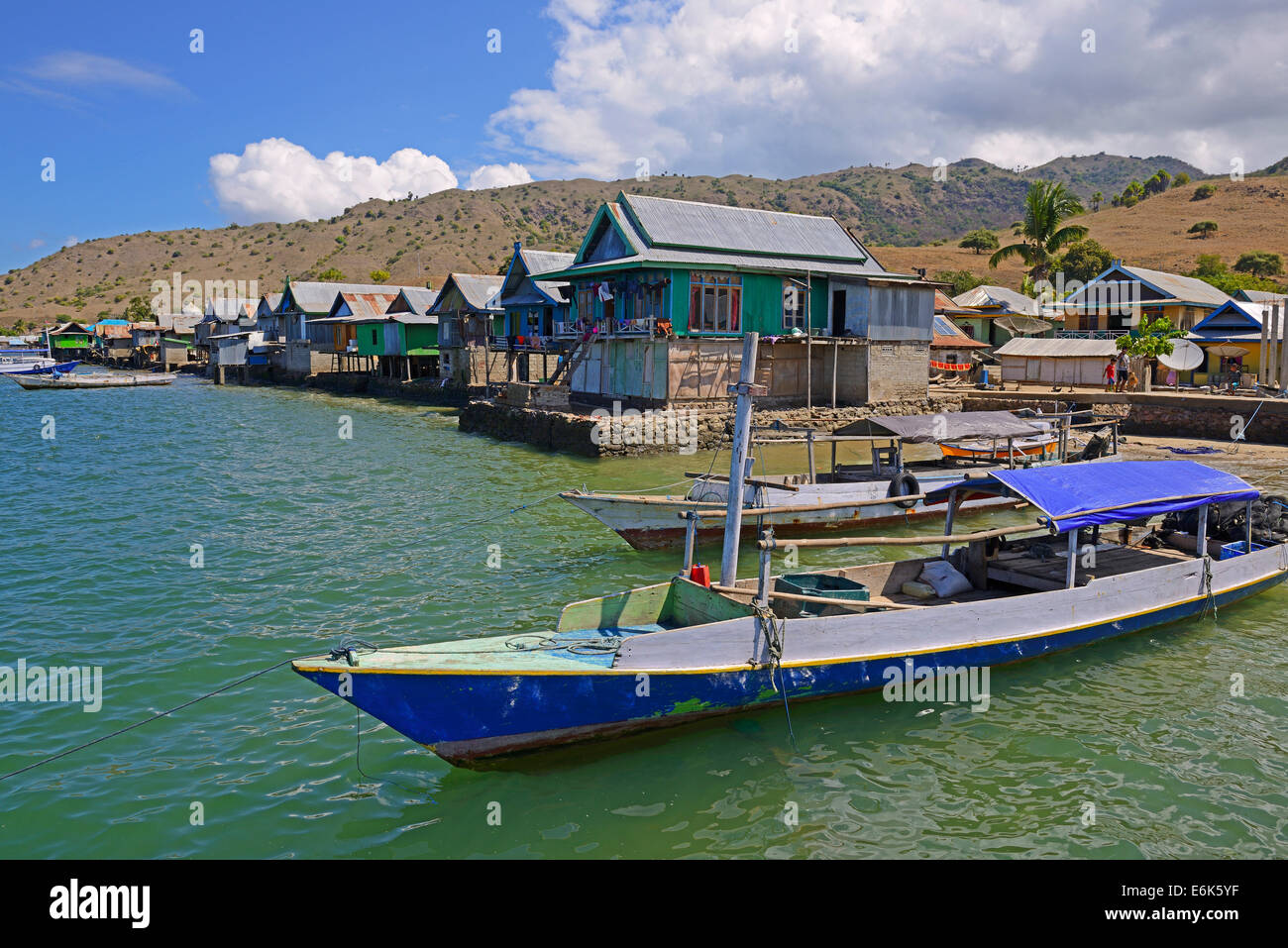 Typical stilt houses at the harbour of the village of Komodo, Komodo ...
