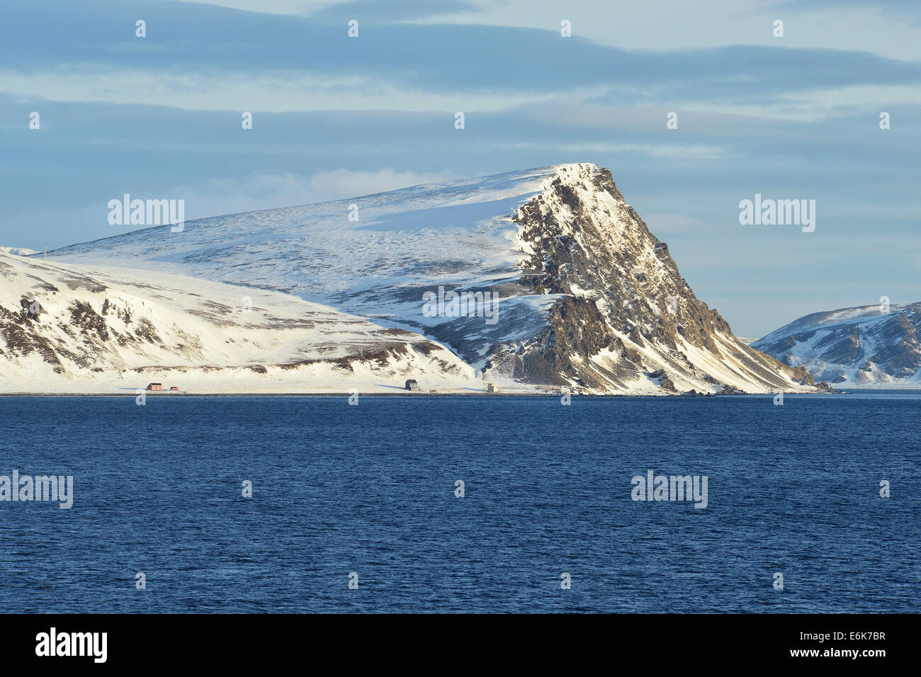 Norwegian Sea and island coast with buildings, Magerøya island ...