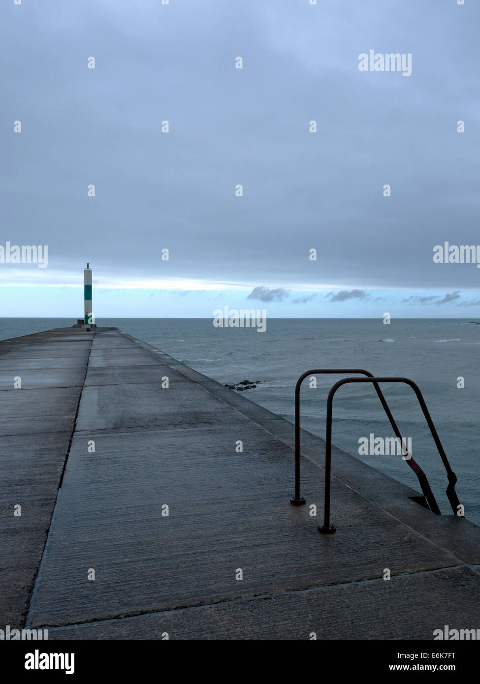 Stone jetty with beacon and steps in Aberystwyth Ceredigion Wales UK ...