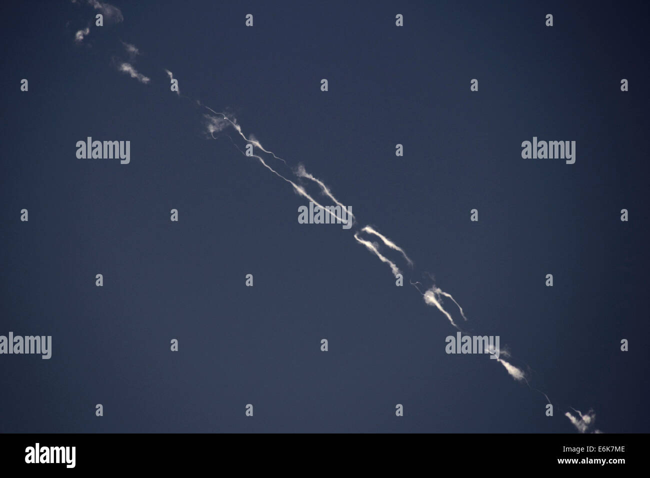 Passenger aircraft with contrails hi-res stock photography and images ...