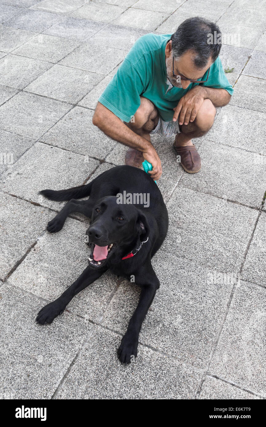 Man with black labrador hi-res stock photography and images - Alamy