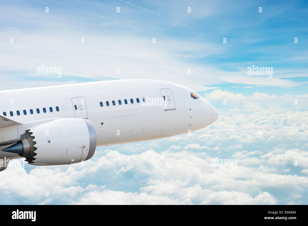 Airplane over clouds Stock Photo - Alamy